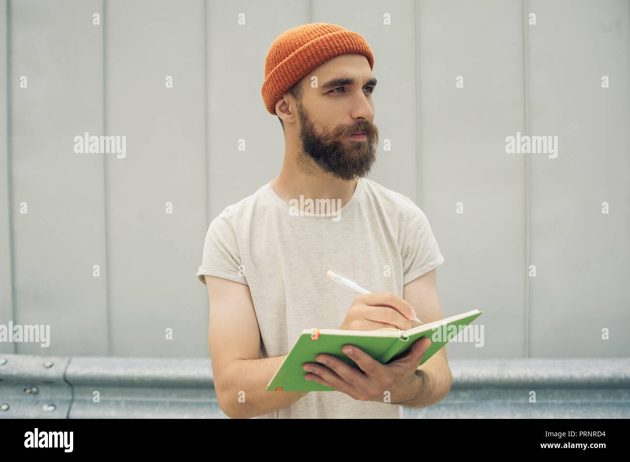 Bearded man writing hi-res stock photography and images - Alamy