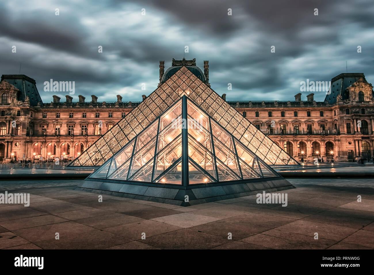Louvre pyramid sunset hi-res stock photography and images - Alamy