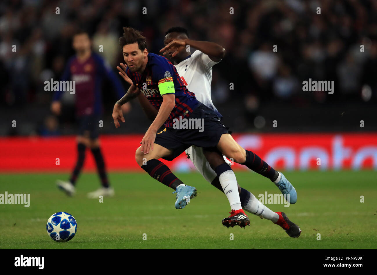 Barcelona's Lionel Messi is challenged from behind during the UEFA ...