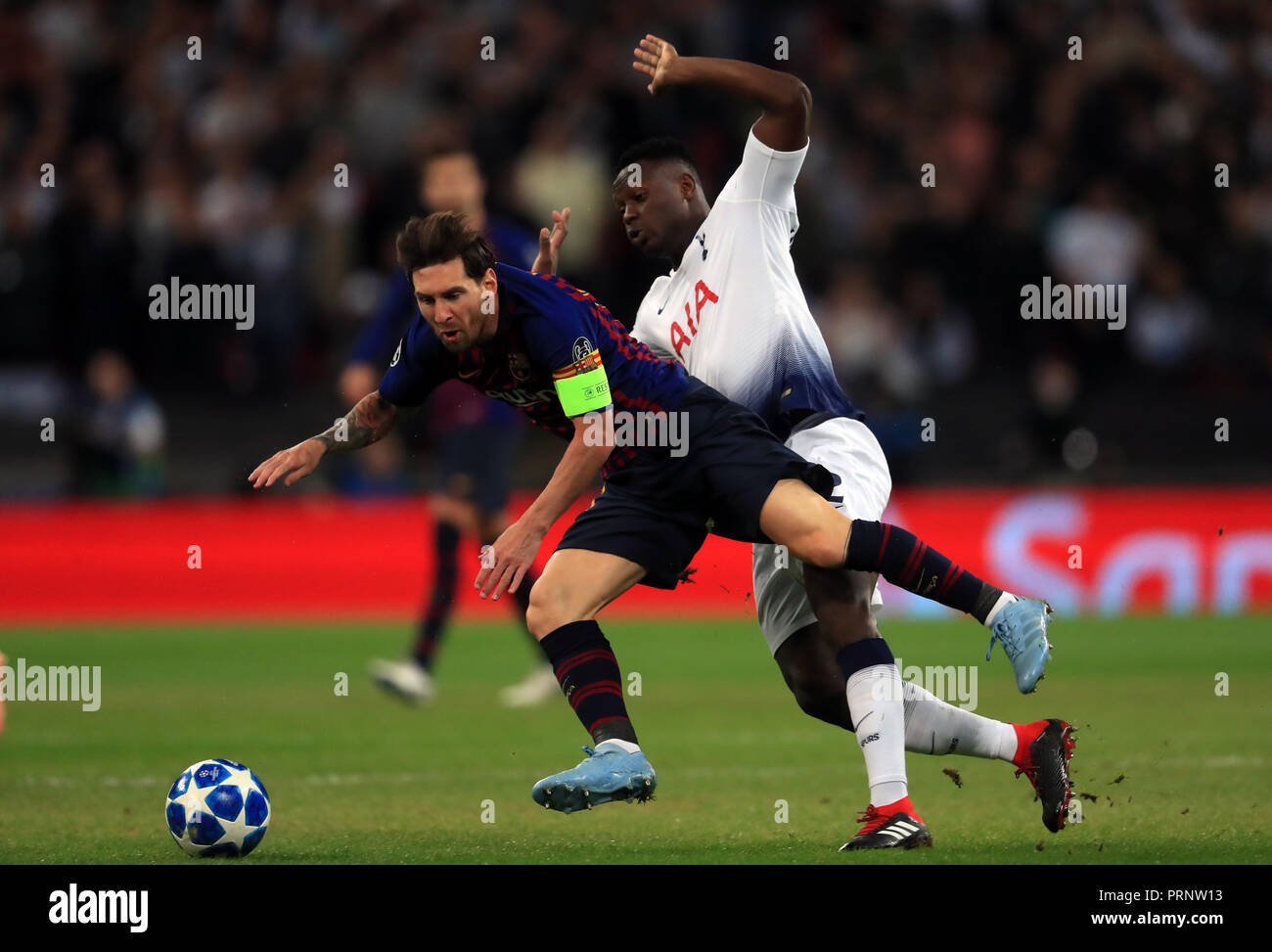 Barcelona's Lionel Messi is challenged from behind during the UEFA ...