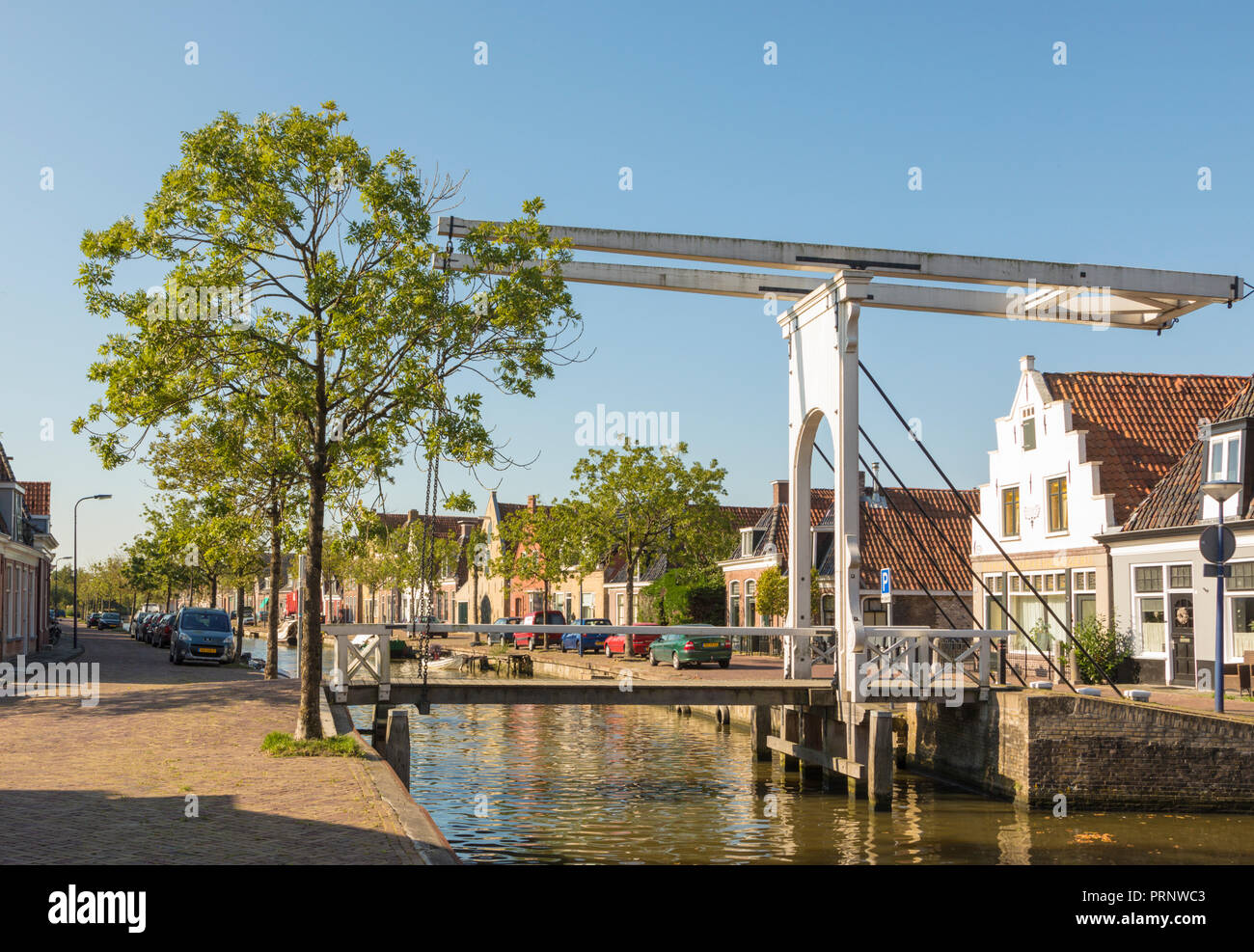 Old wooden drawbridge over canal at the village of Franeker, The ...