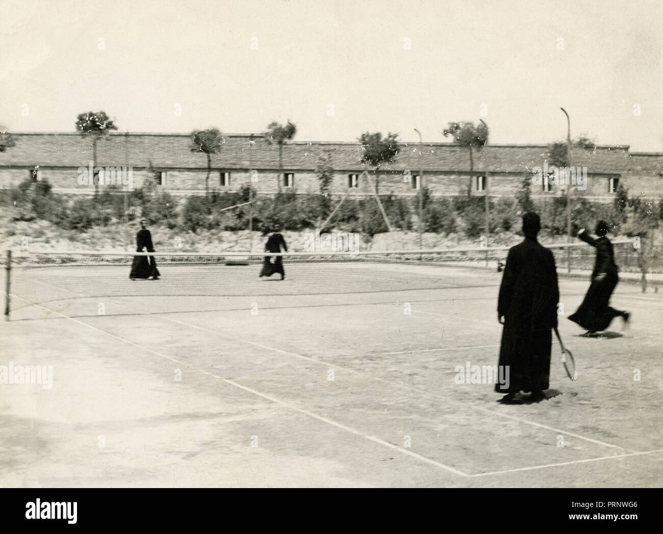 Priests playing double, Italy 1930s Stock Photo - Alamy