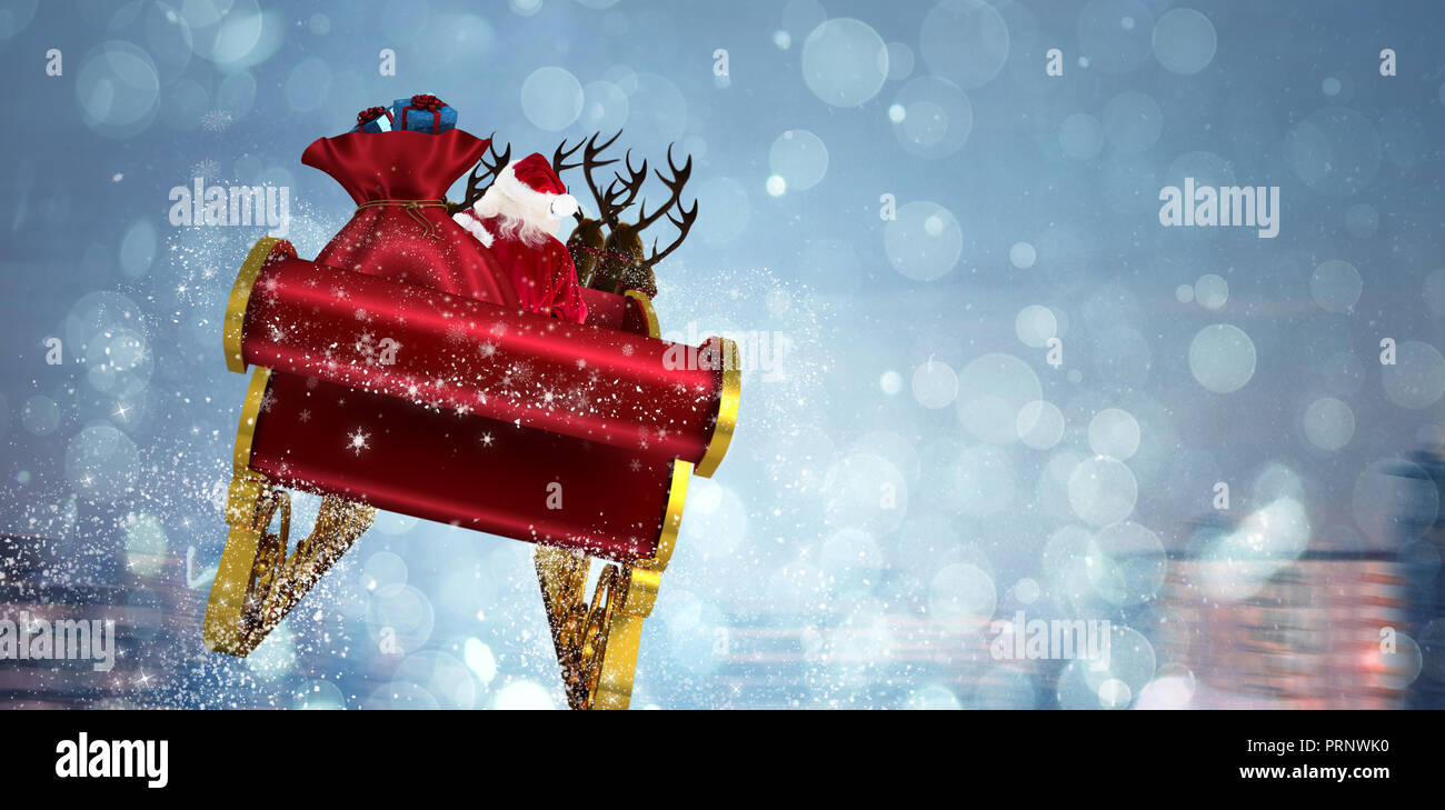 Composite image of santa flying his sleigh Stock Photo - Alamy