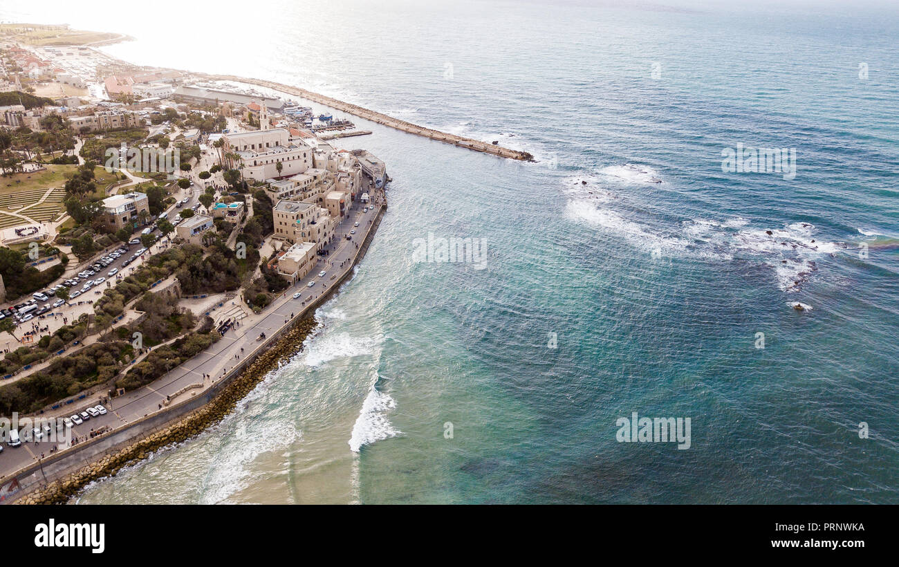 aerial view of beautiful town on seashore with sunshine reflecting in ...