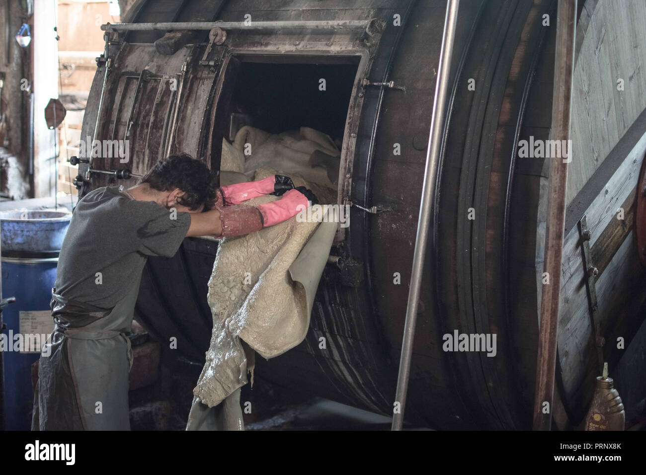 A tanner seen resting during the leather processing at the leather ...