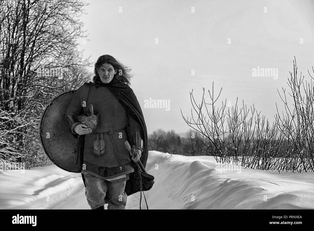 Defender the young warrior in armor Stock Photo - Alamy