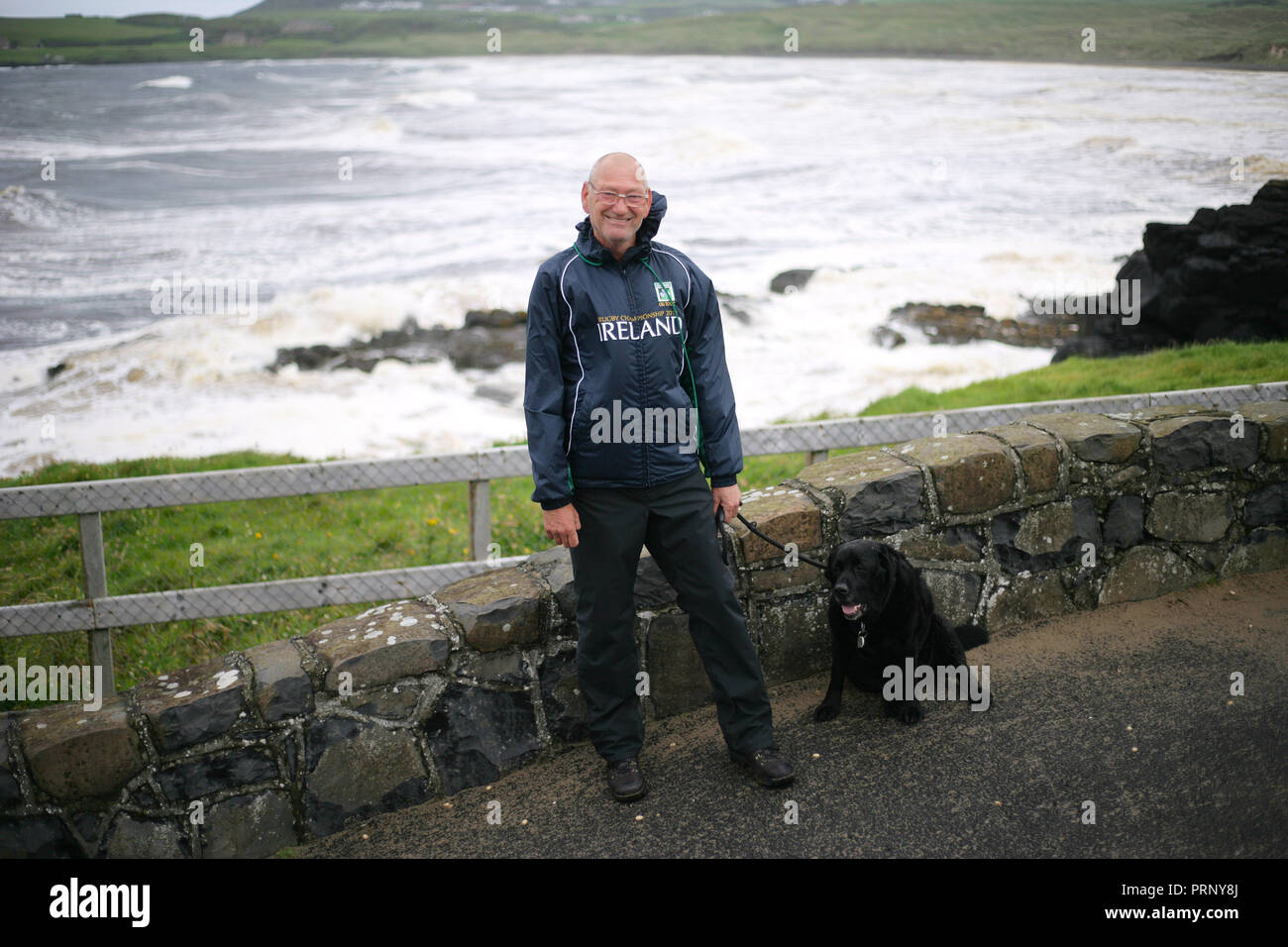 Crawford Batchelor with his dog JJ at a windy Portballintrae, County ...