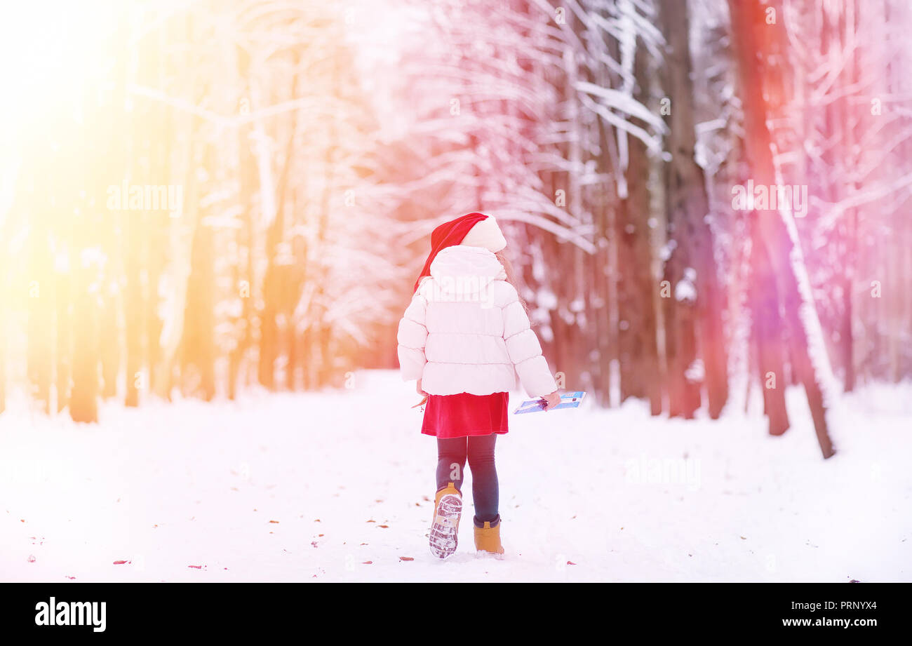 A winter fairy tale, a young mother and her daughter ride a sled Stock ...