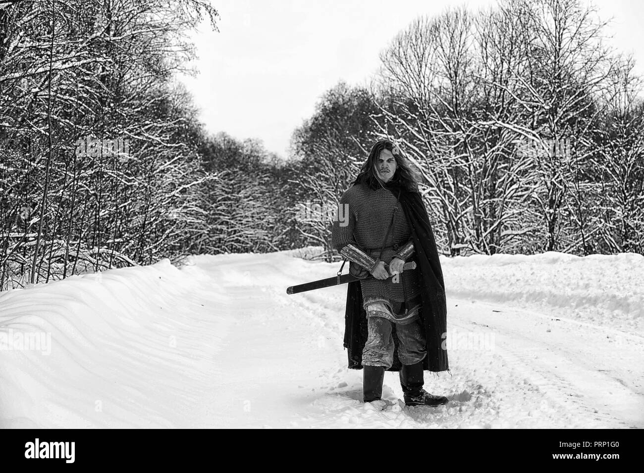 Defender the young warrior in armor Stock Photo - Alamy