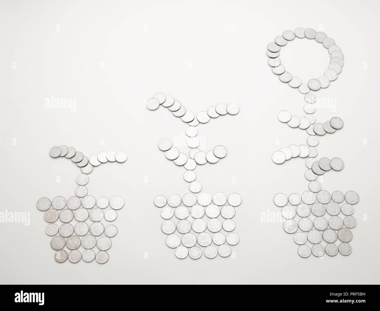 Silver coins in shape dollar hi-res stock photography and images - Alamy