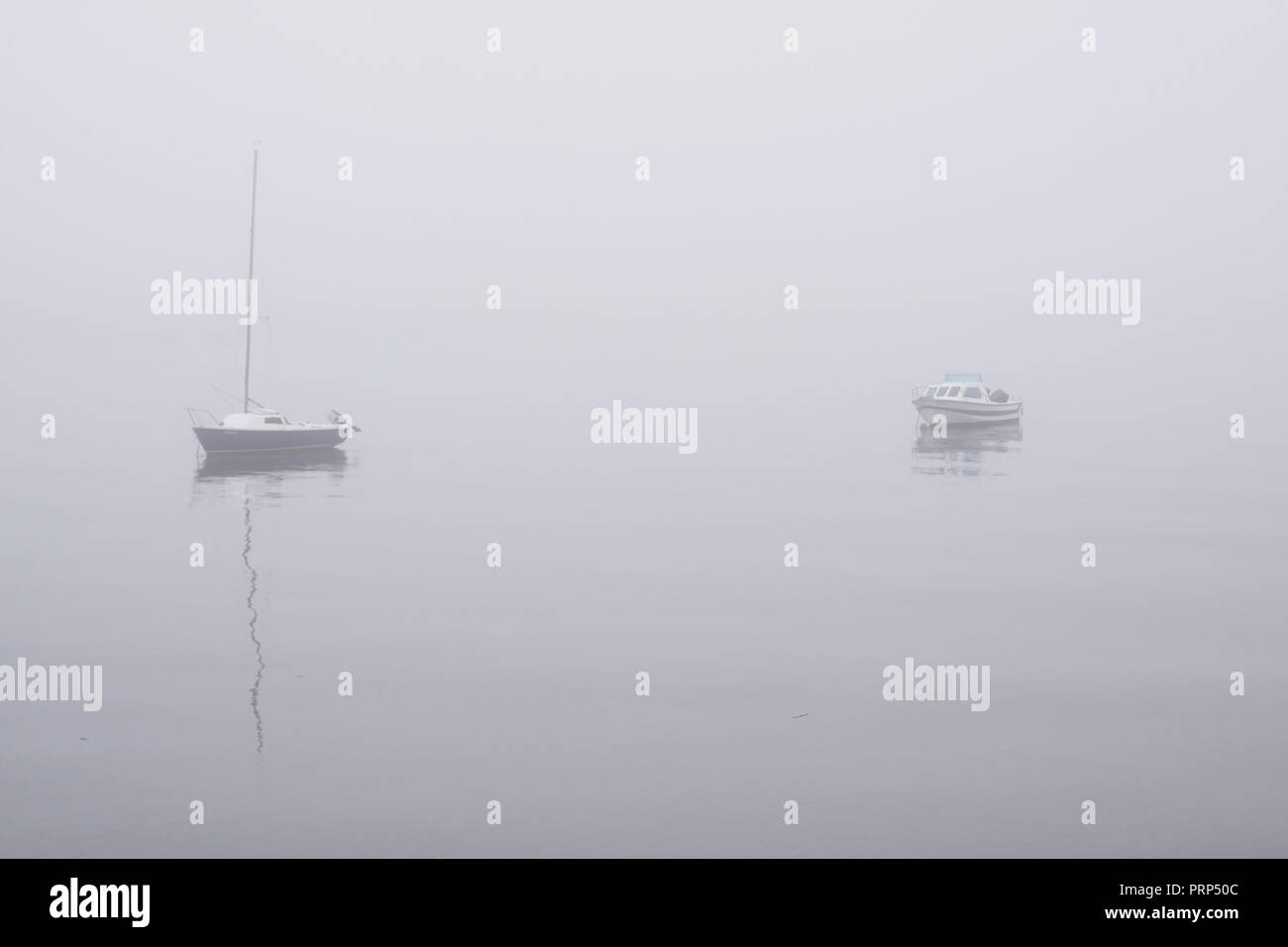 Beautiful foggy morning in Douro river border in Portugal with little ...