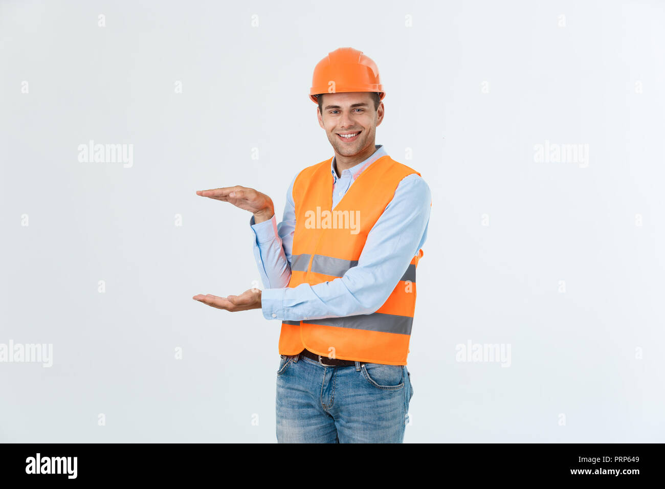 Happy beard engineer holding hand on side and explaining something, guy ...