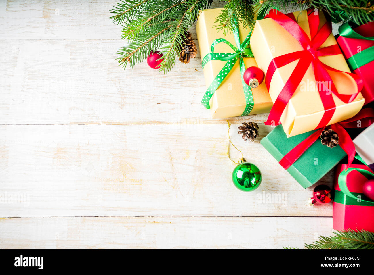 Christmas festive background with decorations and colorful gift boxes ...