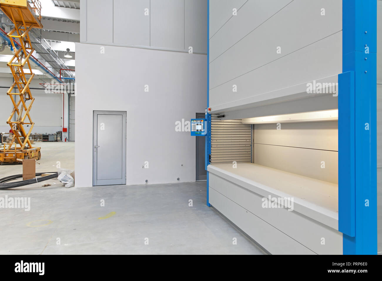 High density carousel storage in distribution warehouse Stock Photo - Alamy