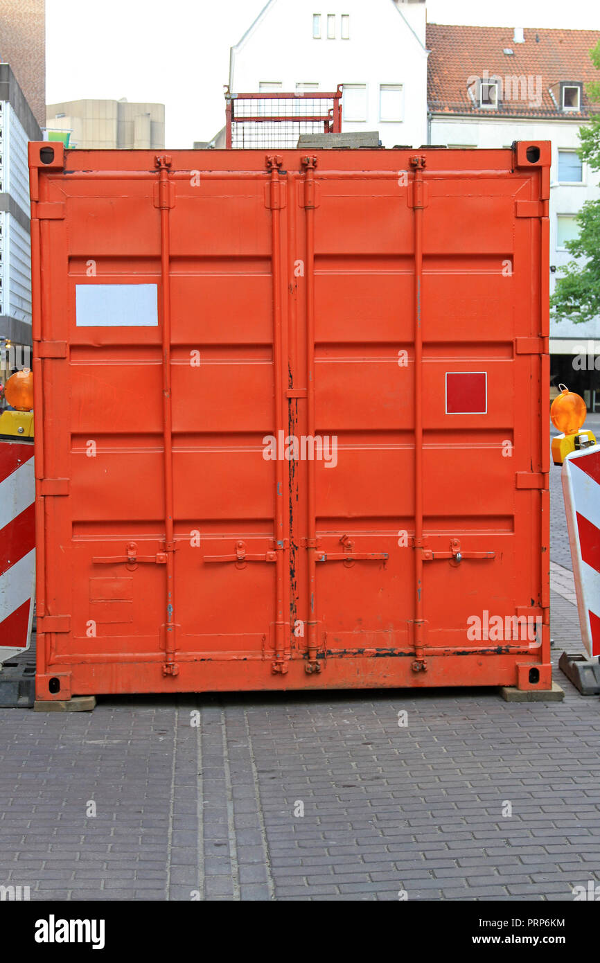 Orange cargo container at city street Stock Photo - Alamy