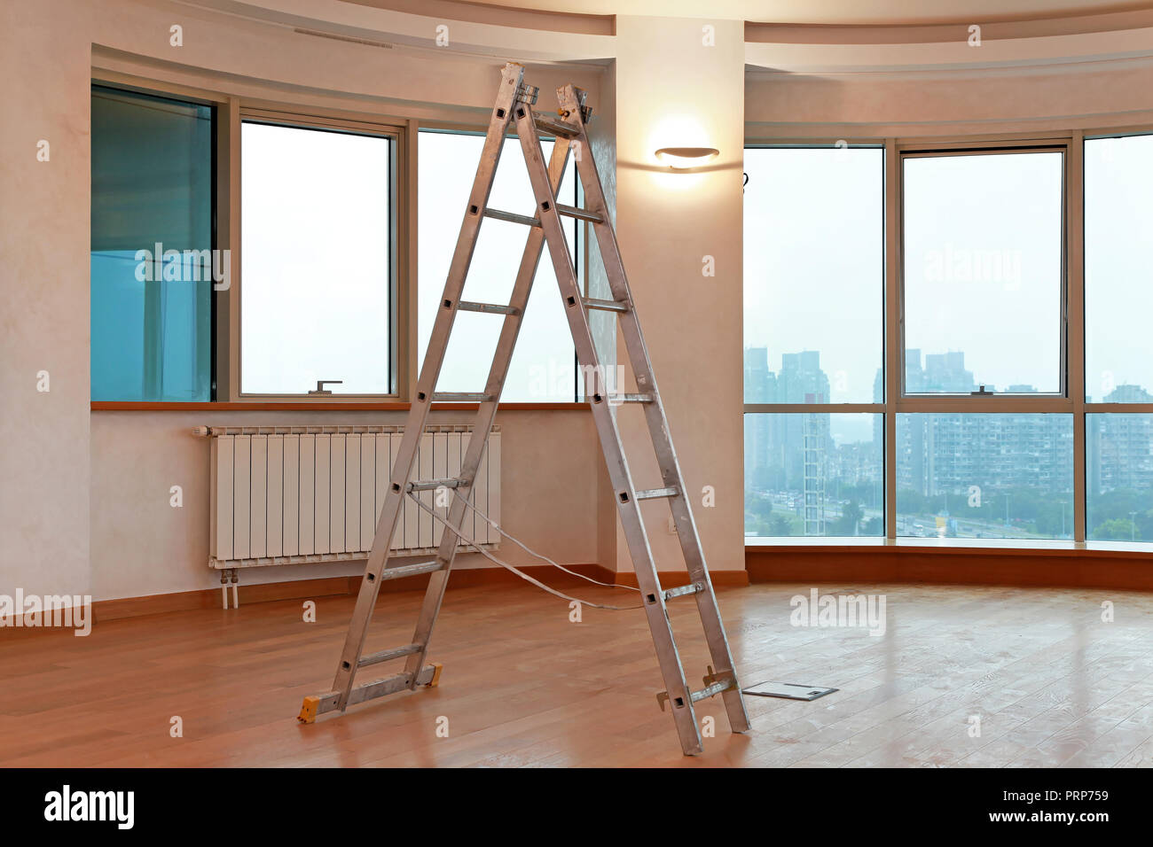 Open A ladder in modern empty living room Stock Photo - Alamy