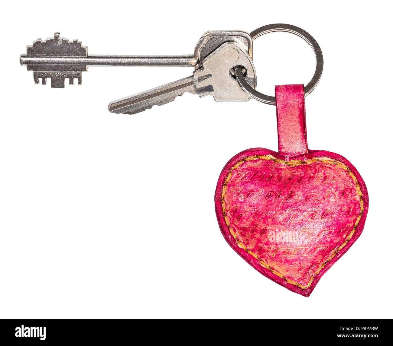 pair of keys on pink colored embossed leather heart shaped key fob ...