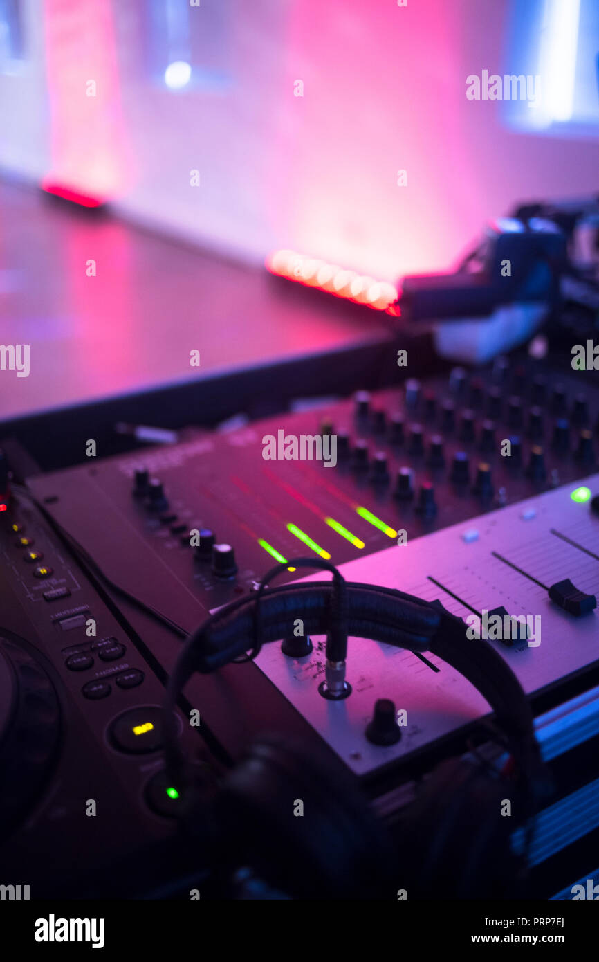 DJ deejay mixing desk equipment in wedding receoption party disco with ...