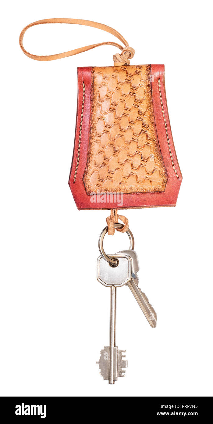 door keys on handmade embossed leather Key Holder cut out on white ...