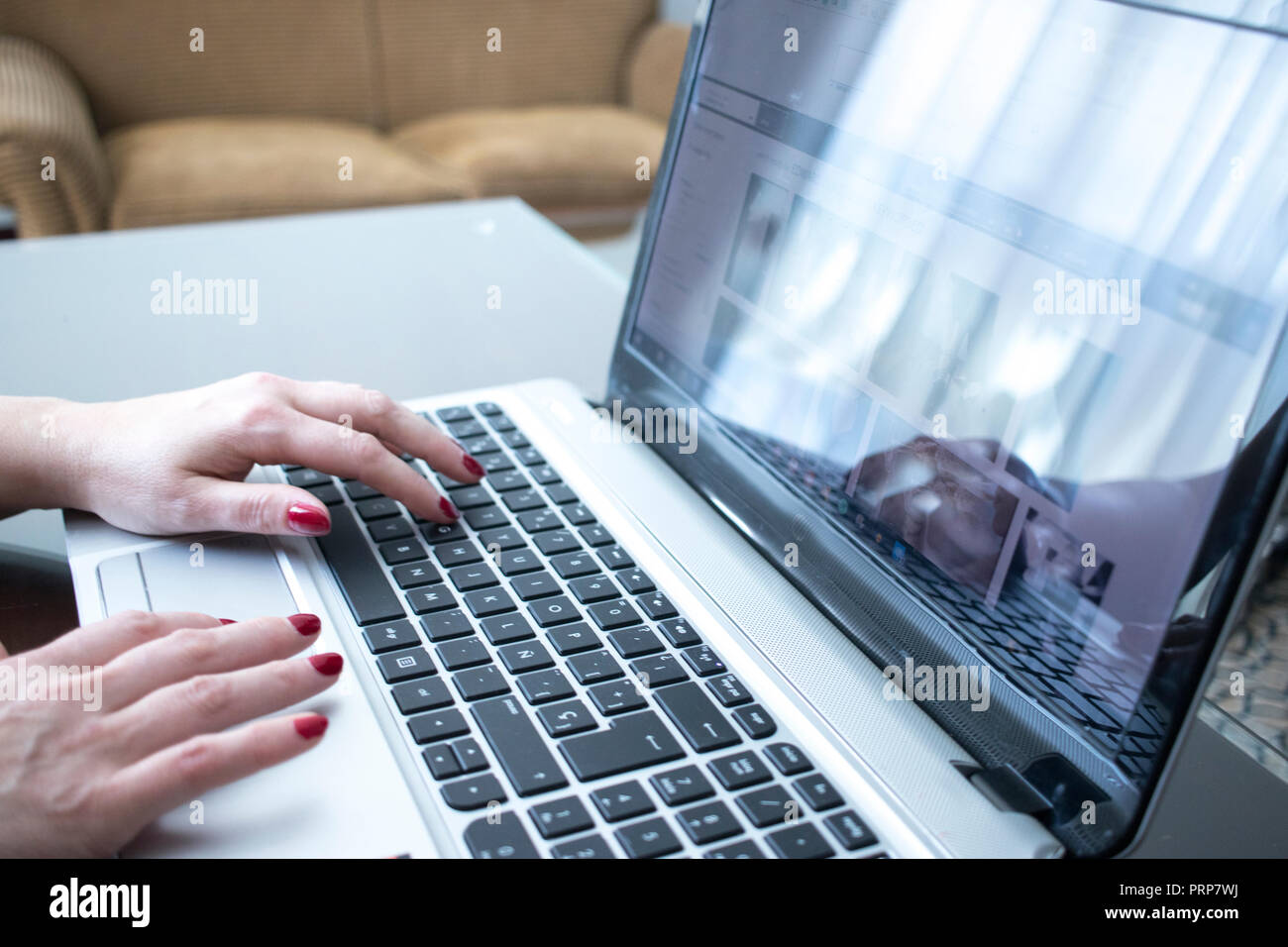 Secretary typist typing on laptop pc computer keyboard keys with hands ...