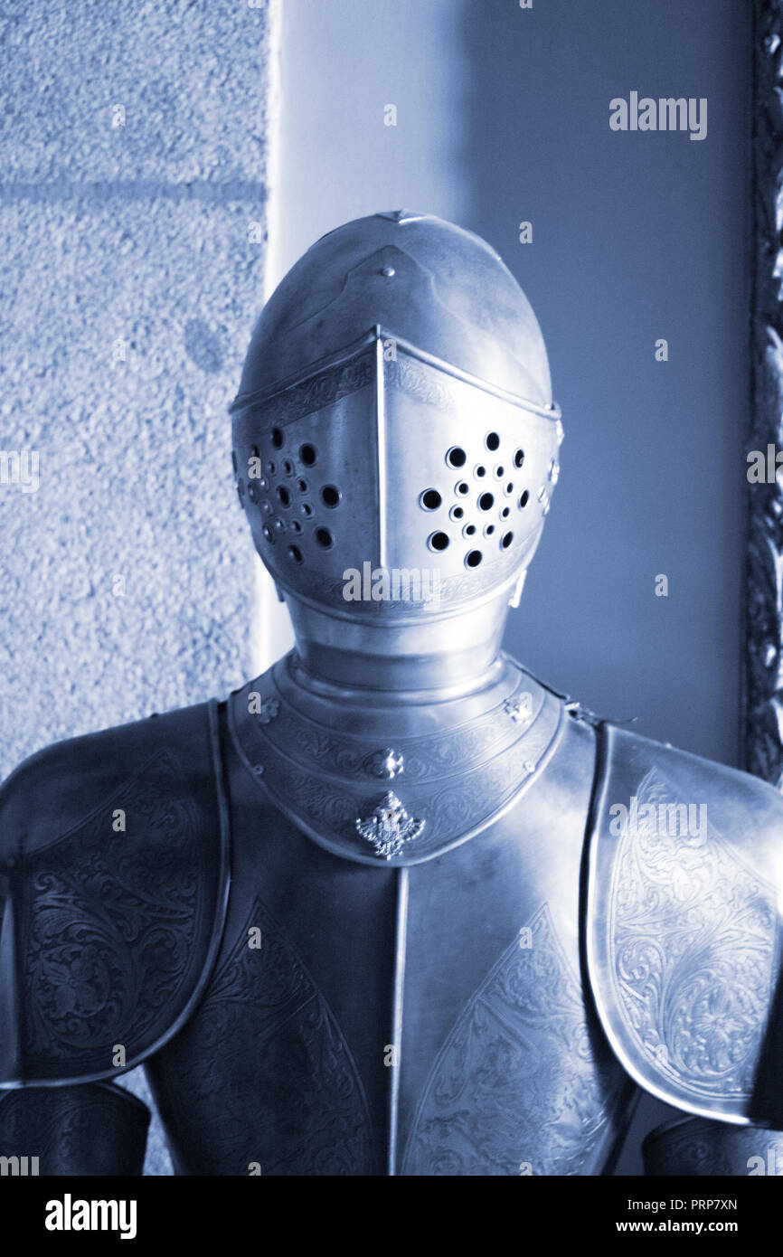 Medieval metal suit of armour and helmet worn by knight in middle ages ...
