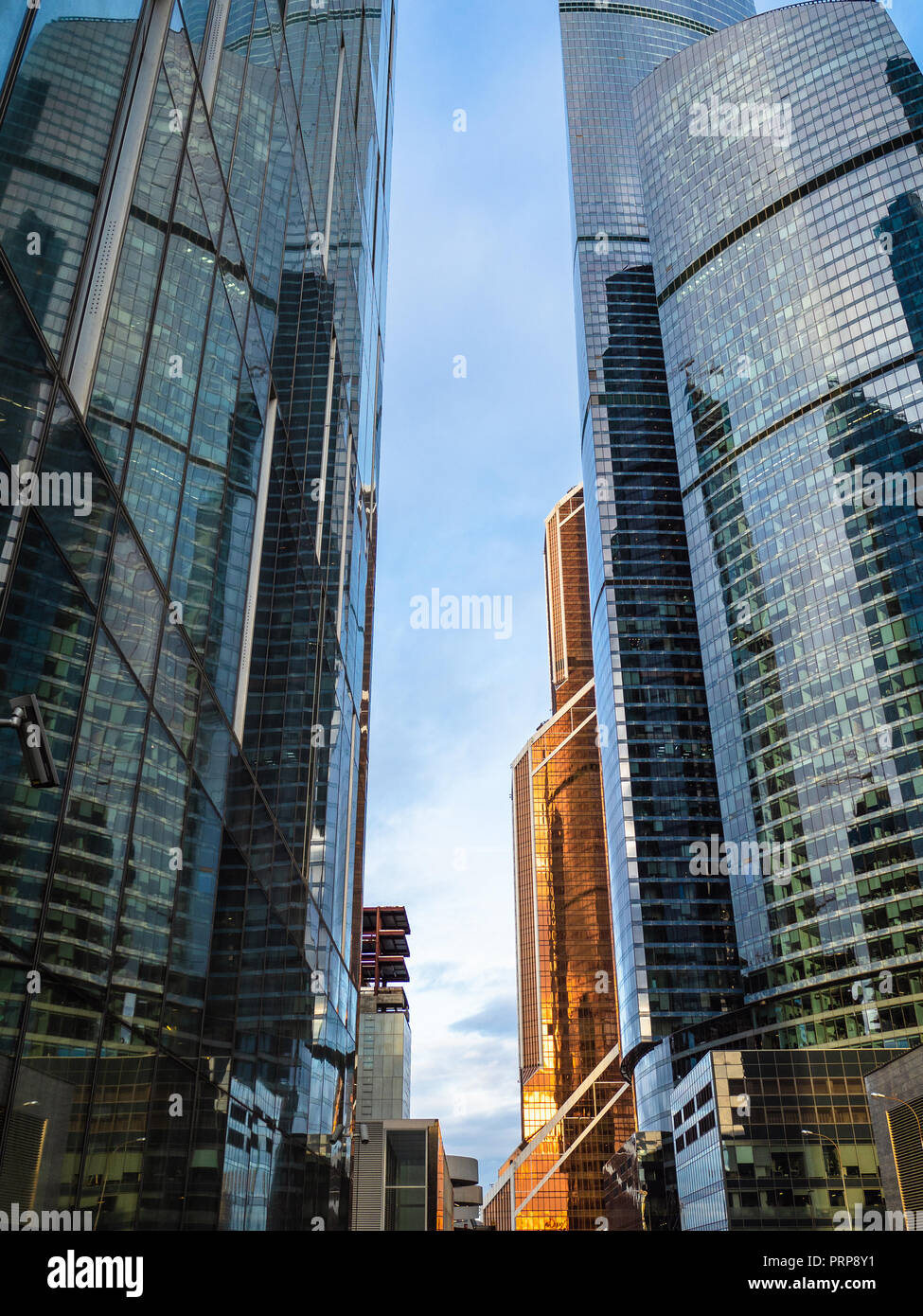 narrow pass between skyscrapers in business district of Moscow city in ...