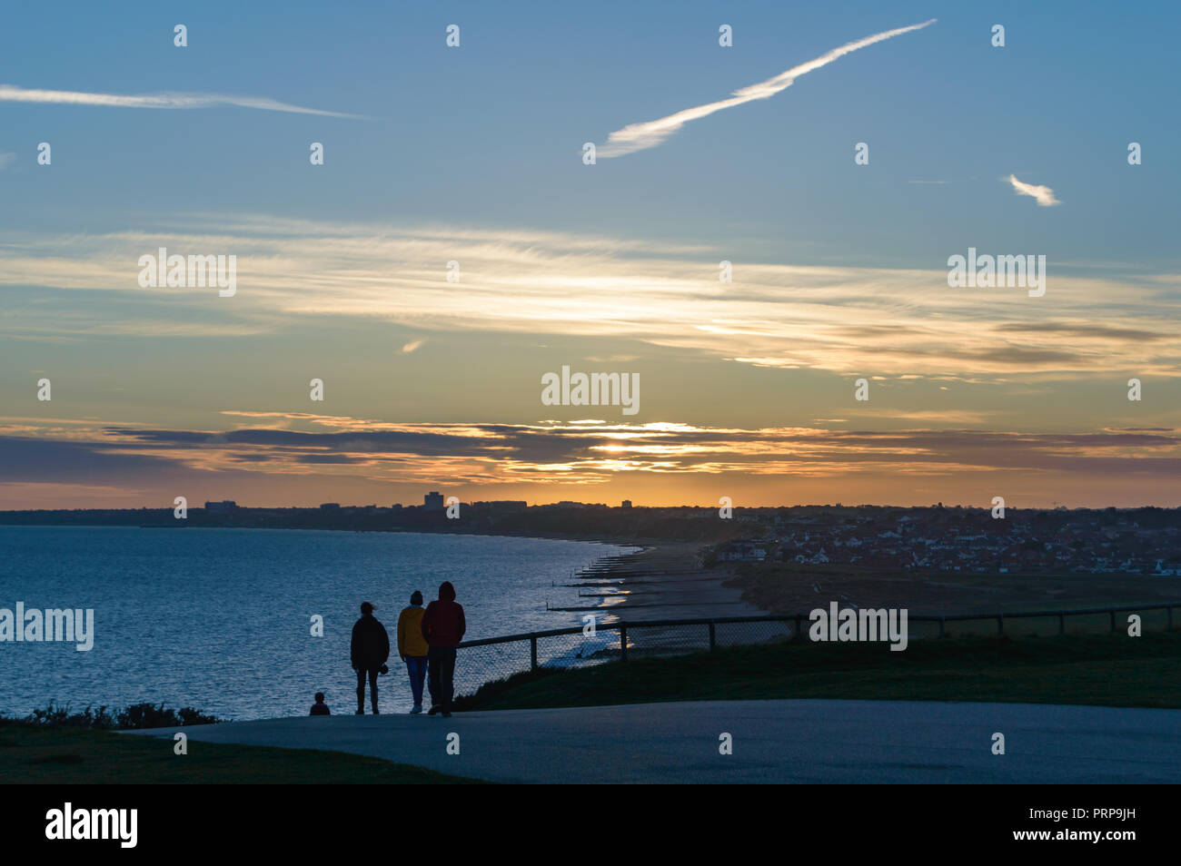 People walking on Bournemouth clifftops, room for text in blue Stock ...