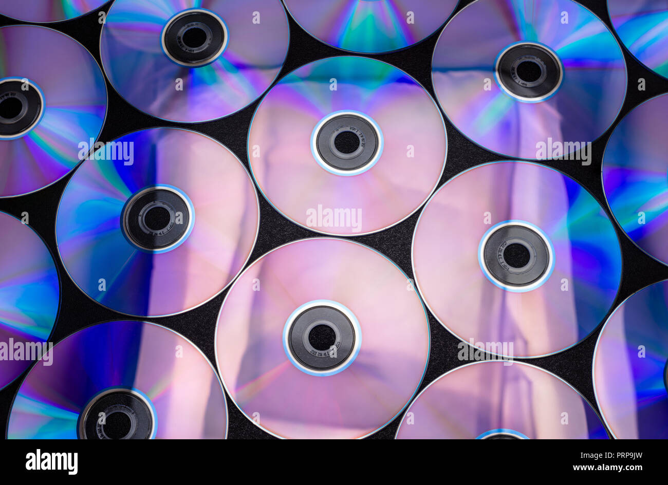 CDs / DVDs lying on a black background with reflections of light Stock ...