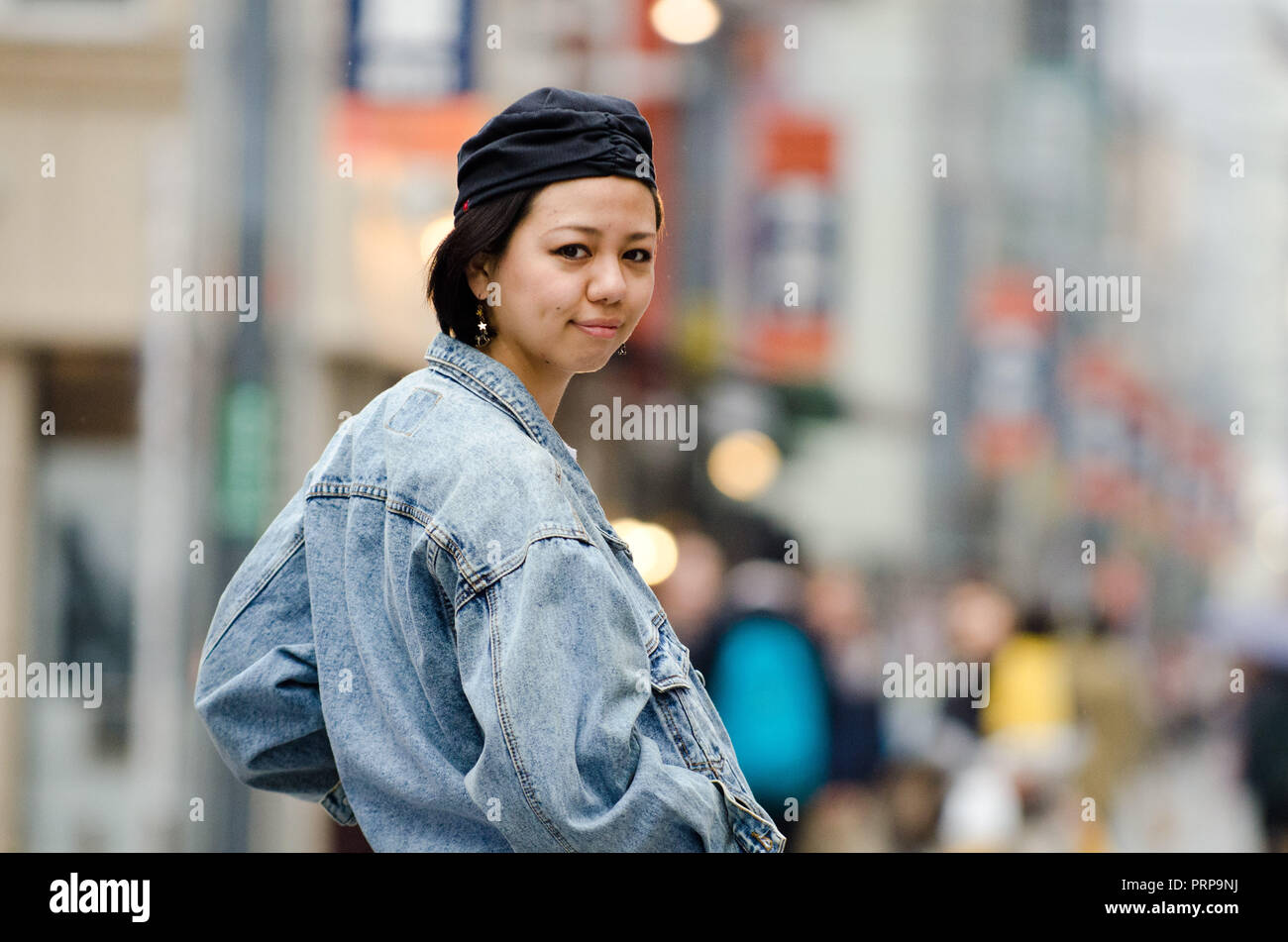 Japanese Girl poses on the street in Machida, Japan. Machida is an area ...