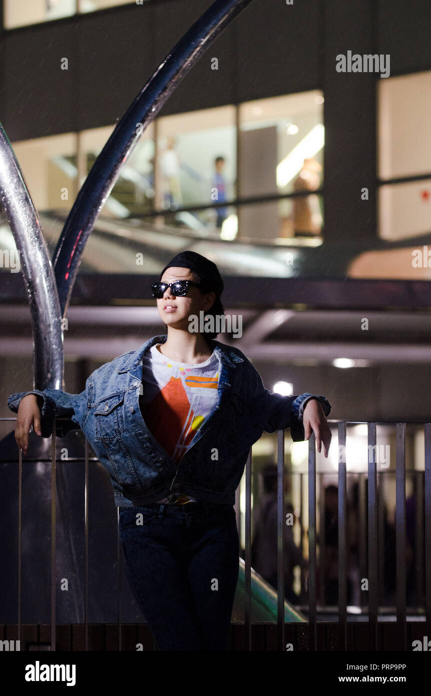 Japanese Girl poses on the street in Machida, Japan. Machida is an area ...