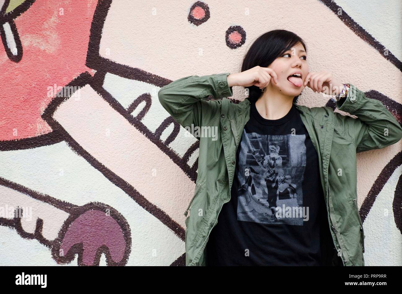 Japanese Girl poses on the street in Machida, Japan. Machida is an area ...