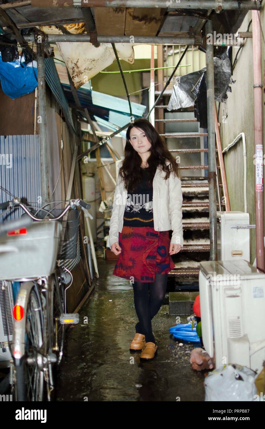 Japanese Girl poses on the street in Fussa, Japan. Fussa is a city ...