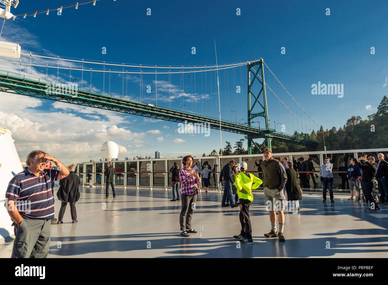 Cruise ship passengers on top deck of Holland America The Volendam, as ...