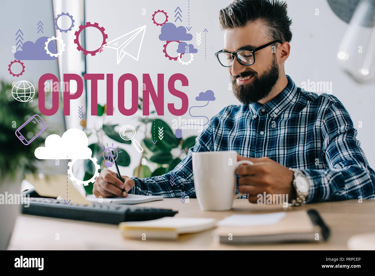 successful businessman with cup of coffee and computer writing notes at ...