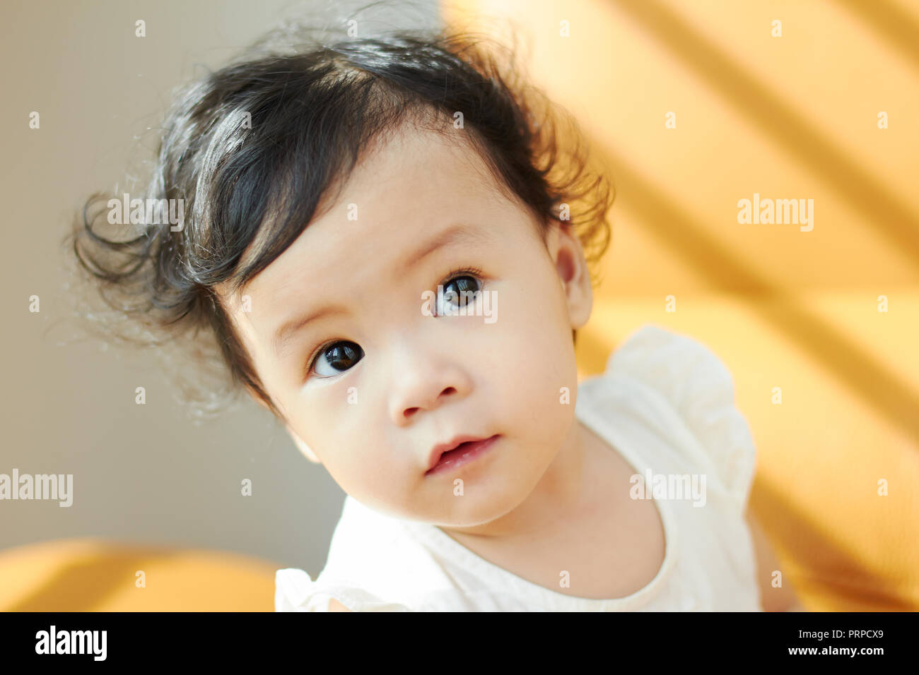 Portrait of cute and lovely curly hair asian chinese baby girl Stock Photo - Alamy