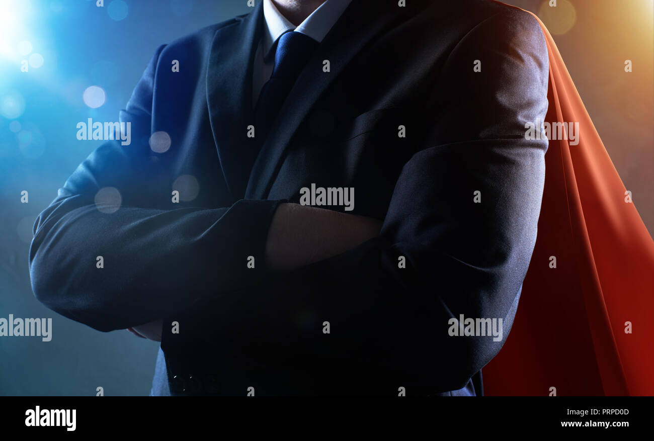 Closeup Businessman in suit and cape hero with crossed arms . bokeh and ...