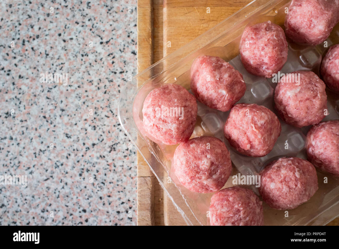 Pork meat balls. Package over cutting board Stock Photo - Alamy