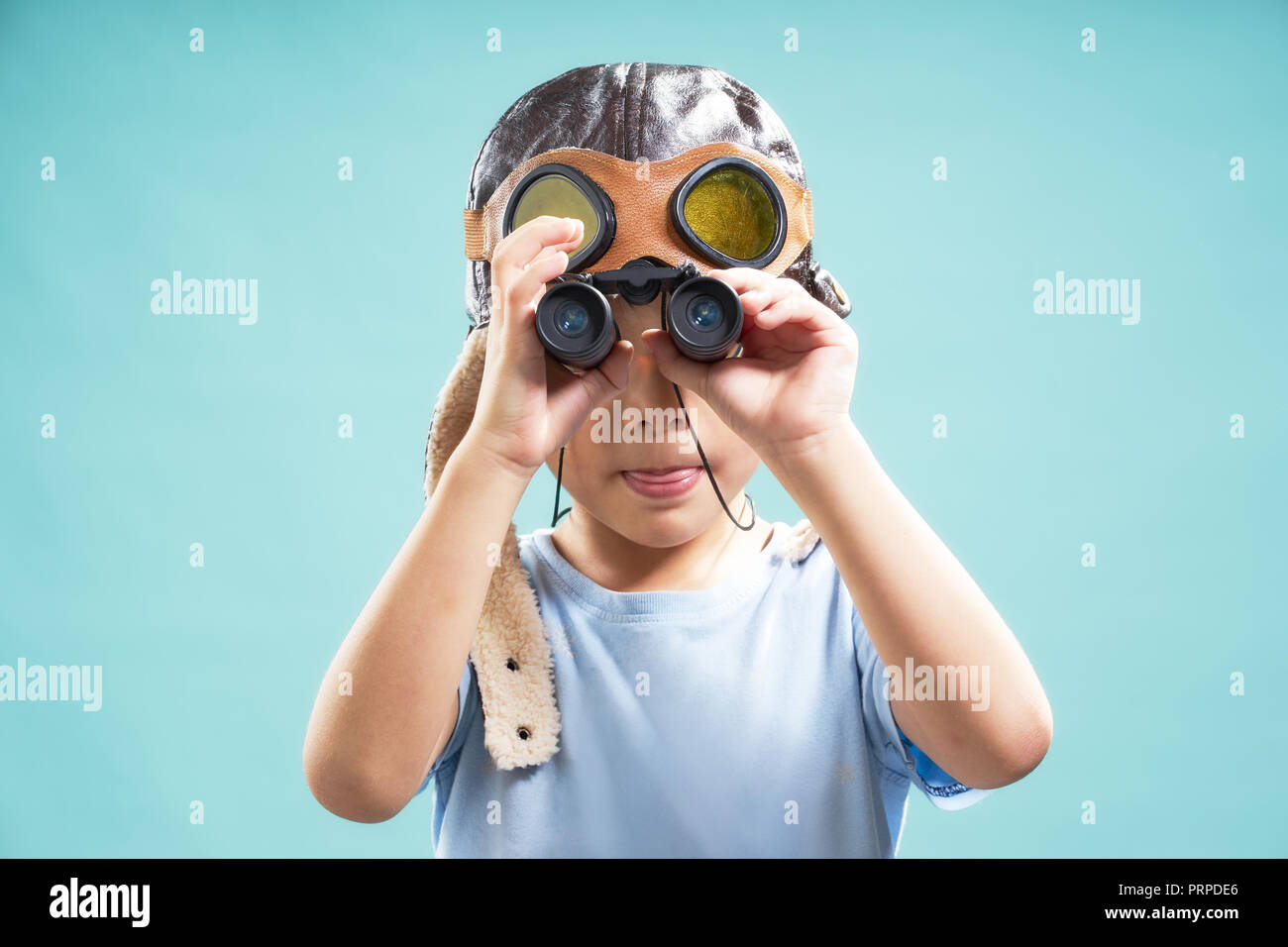 Little young cute asian boy using telescope looking forward Stock Photo ...