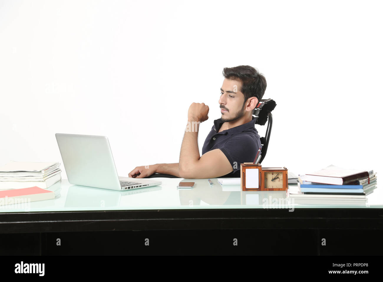Man is looking laptop sitting on the chair in the office. Isolated on ...
