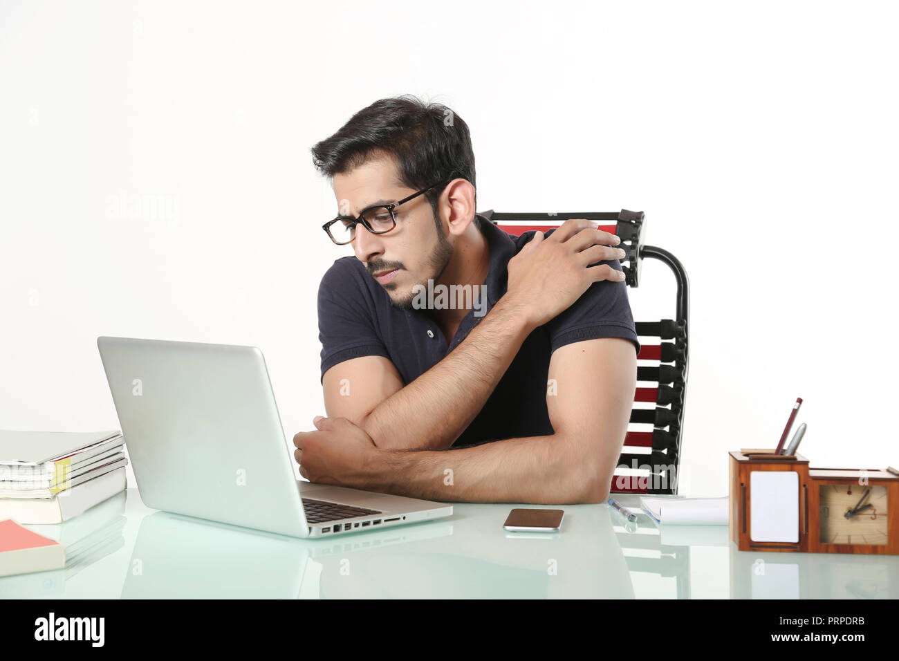 Business man is looking work in laptop with wearing black glasses ...