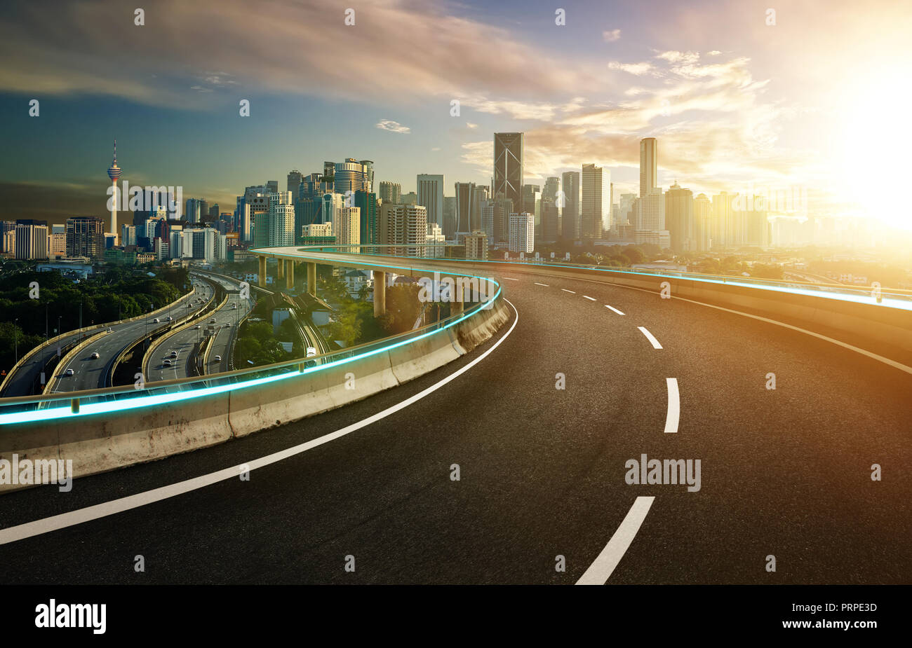 Blue neon light design highway overpass with modern city background ...