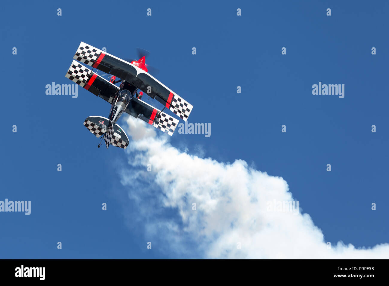 Airshow biplane airplane smoke aerobatics hi-res stock photography and ...
