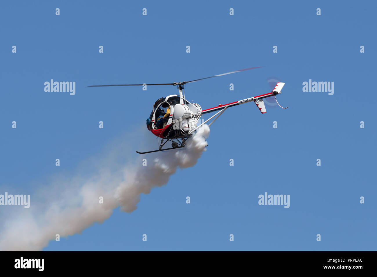 Schweizer 300C "Otto the helicopter" performing a flying display Stock ...