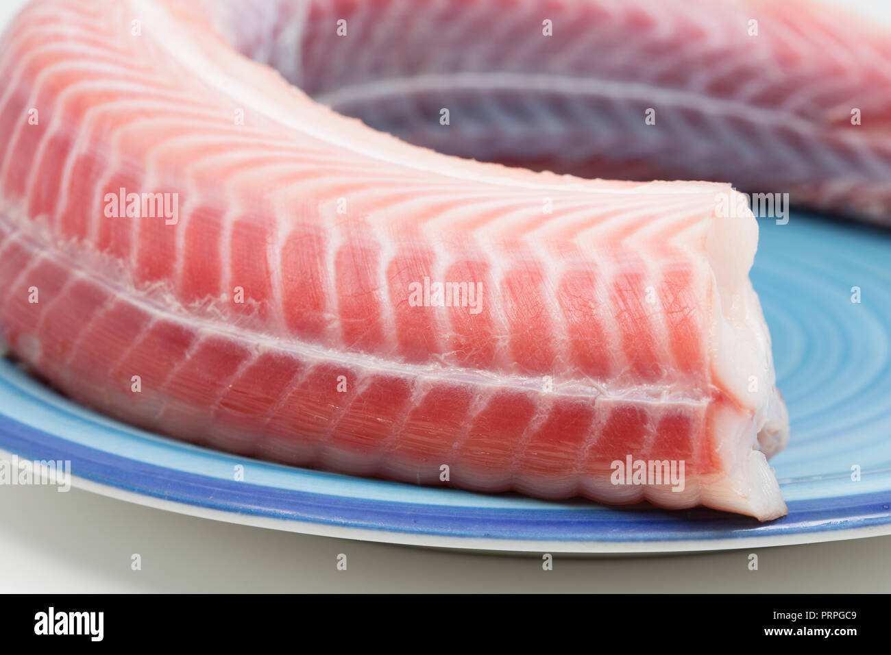 A skinned section of raw bull huss, Scyliorhinus stellaria, prepared ...