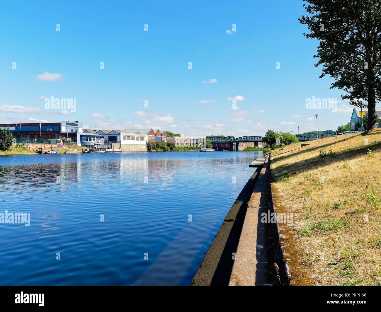 Looking down the River Trent, towards Lady Bay bridge where a barge ...