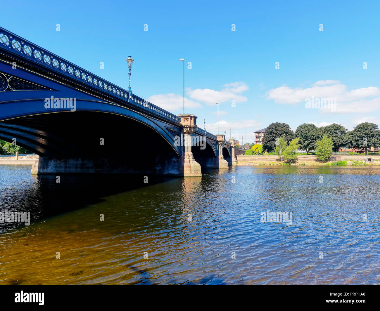 The three arch road bridge, Trent Bridge, spans the River Trent on a ...