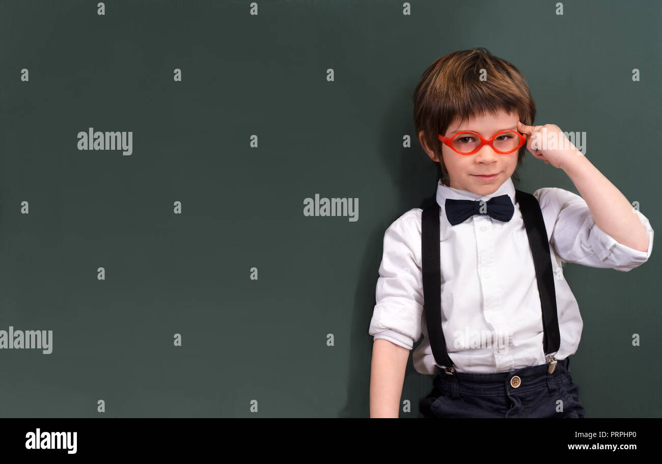 School intelligent child develops idea in the slate Stock Photo - Alamy