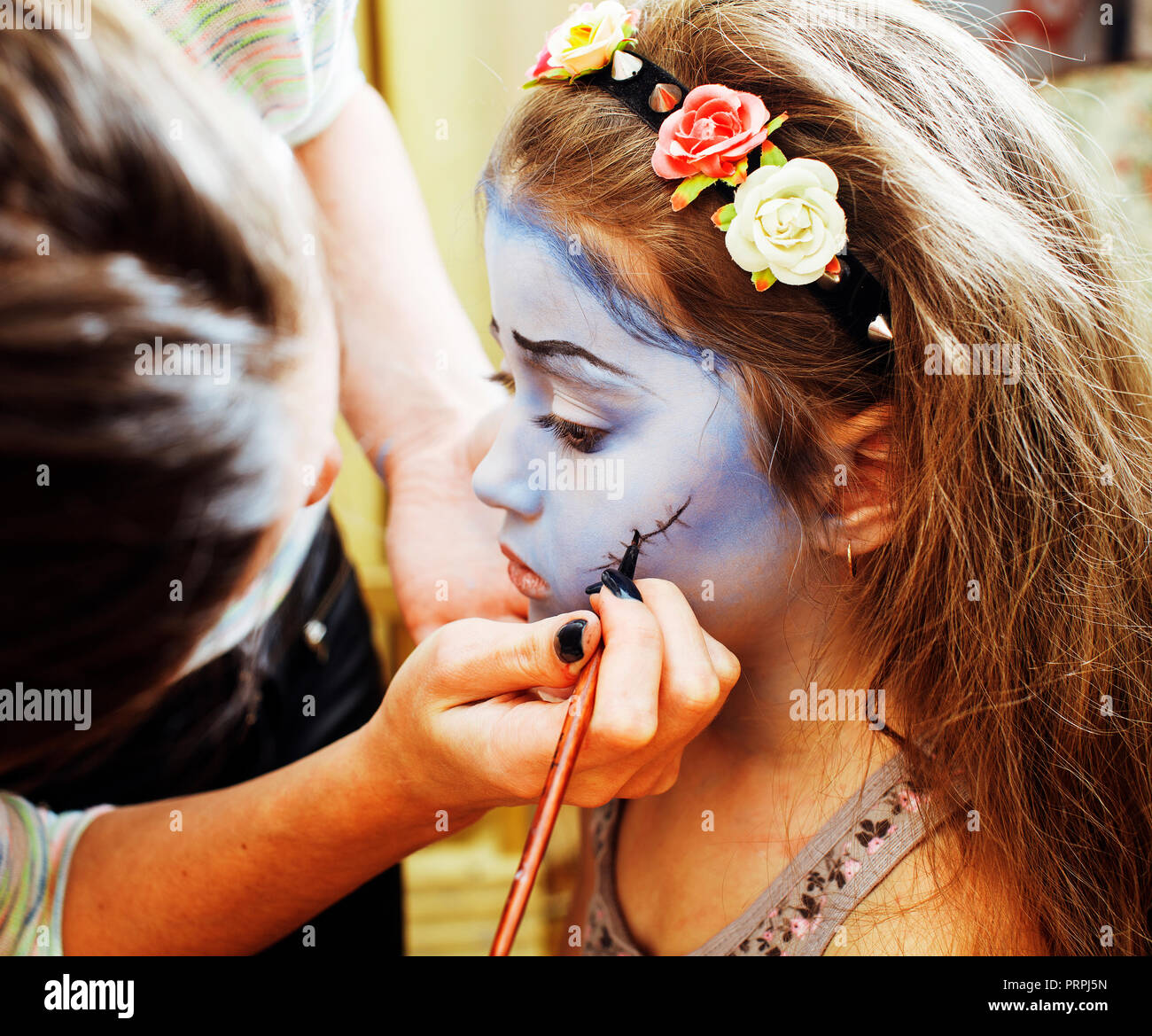 little cute child making facepaint on birthday party, zombie Apo Stock ...
