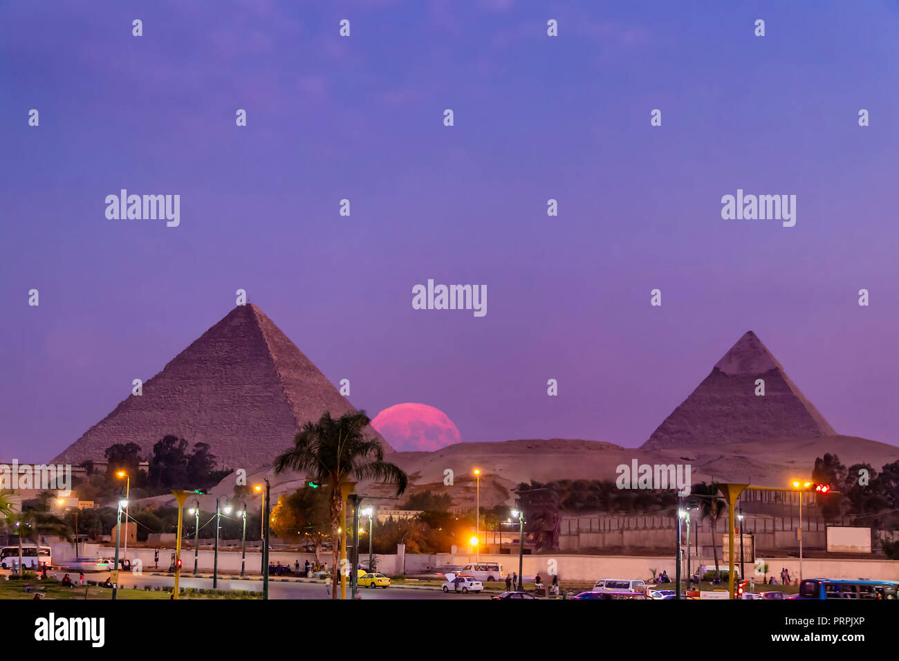 View of the great pyramids of Giza at sunset from Giza city with big ...