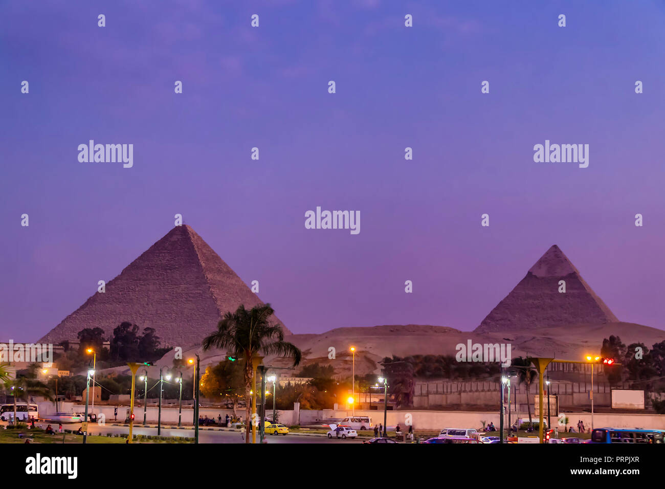 View of the great pyramids of Giza at sunset from Giza city Stock Photo ...